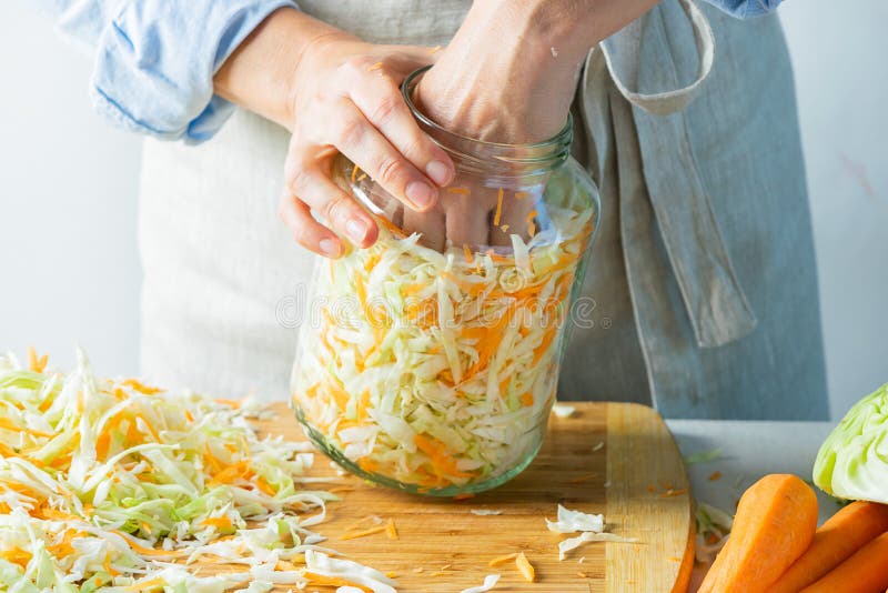 The Preparation Process Fermentation Preservation Sauerkraut on a Light ...
