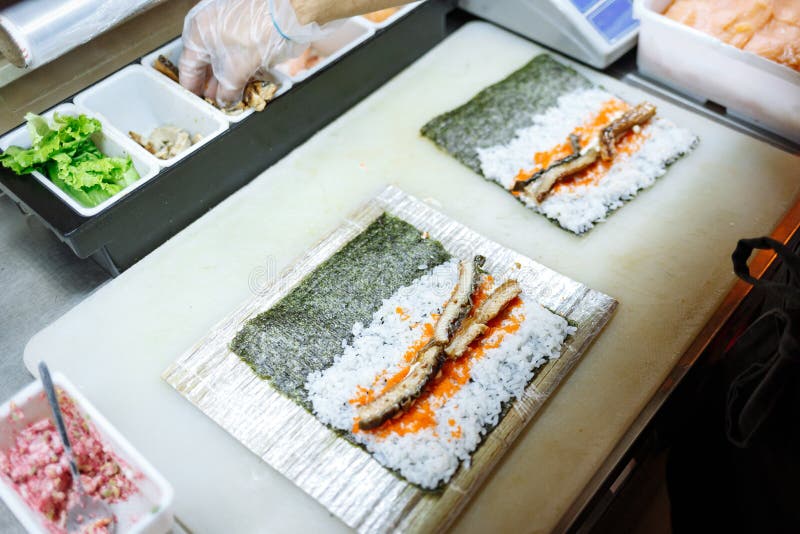 Preparation of Rolls on a Board on the Table in the Kitchen of the ...