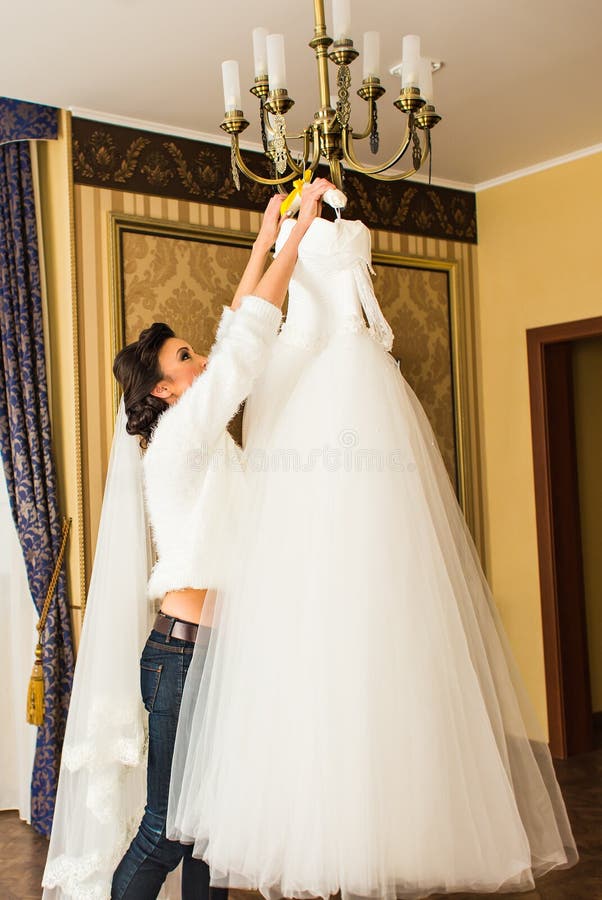 Preparations for the Wedding . Bride and a White Dress Stock Image ...
