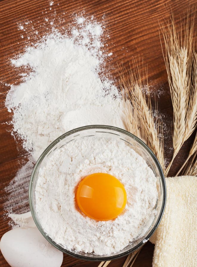 Spikelets of Wheat with Egg on Flour Spillage.Isolated. Stock Image ...