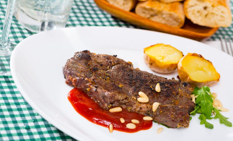 Prepared Beef Steak with Tomatoe Ketchup and Pine Nuts Stock Image ...