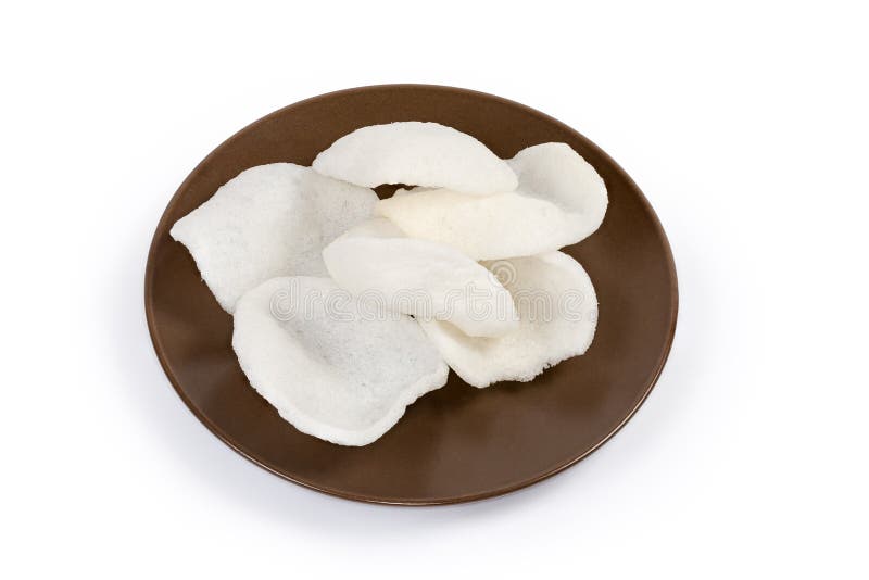 Prepared Rice Chips on Brown Dish on a White Background Stock Photo ...