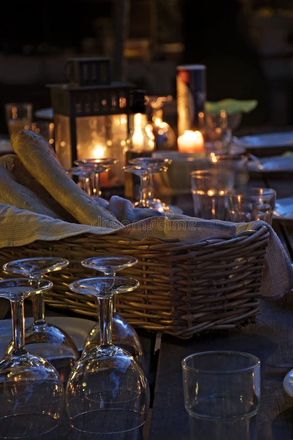 Prepared Table for a Rustic Outdoor Dinner at Night Stock Image - Image ...