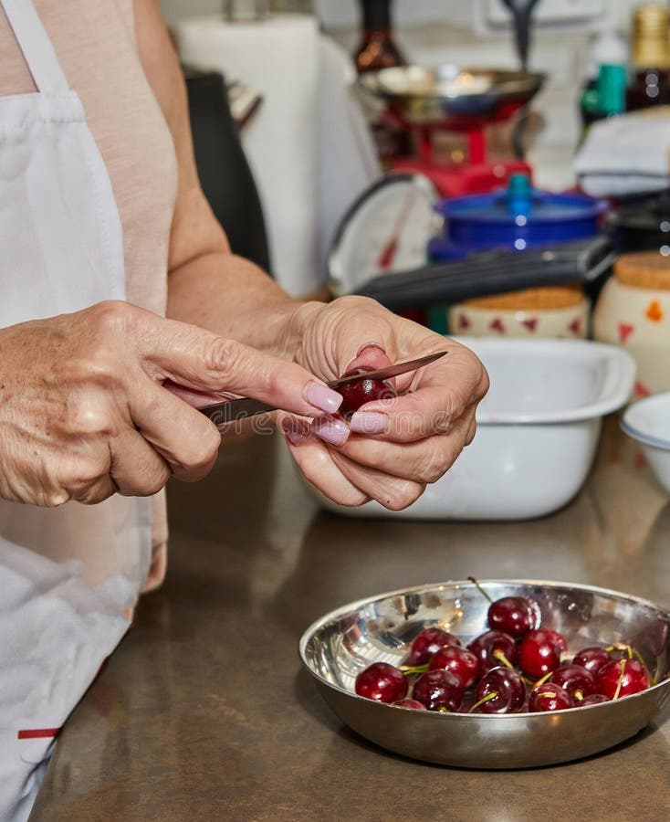 Prepares Cherries, Pits Cherries To Make Cherry Pie Stock Photo - Image ...