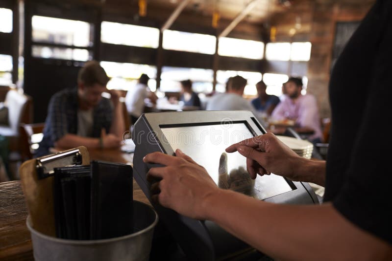 Preparing the Bill at a Restaurant Using a Touch Screen Till Stock ...