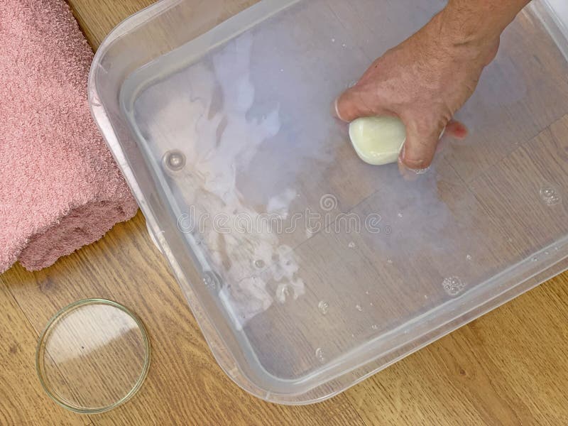 Preparing a Bowl of Soapy Water for Soaking Your Feet. Stock Photo ...