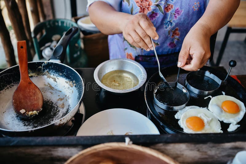 Preparing Breakfast Fried Eggs on the Pan by Human Hands Stock Photo ...