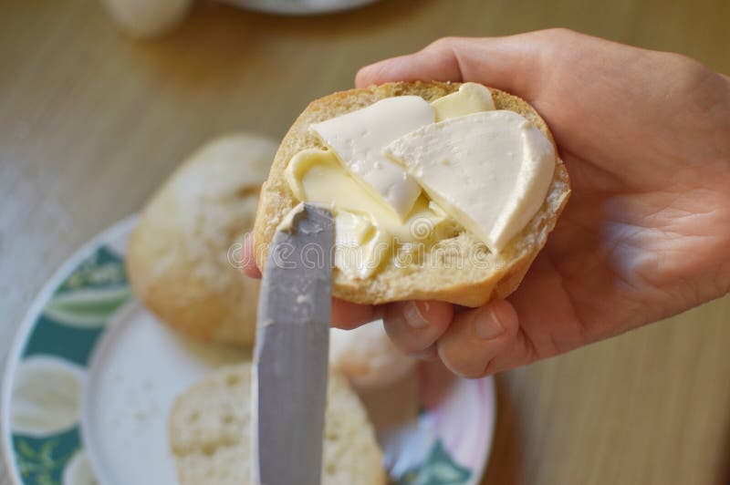 Preparing a Breakfast, Sandwich of White Bread, Butter and Soft Cheese ...