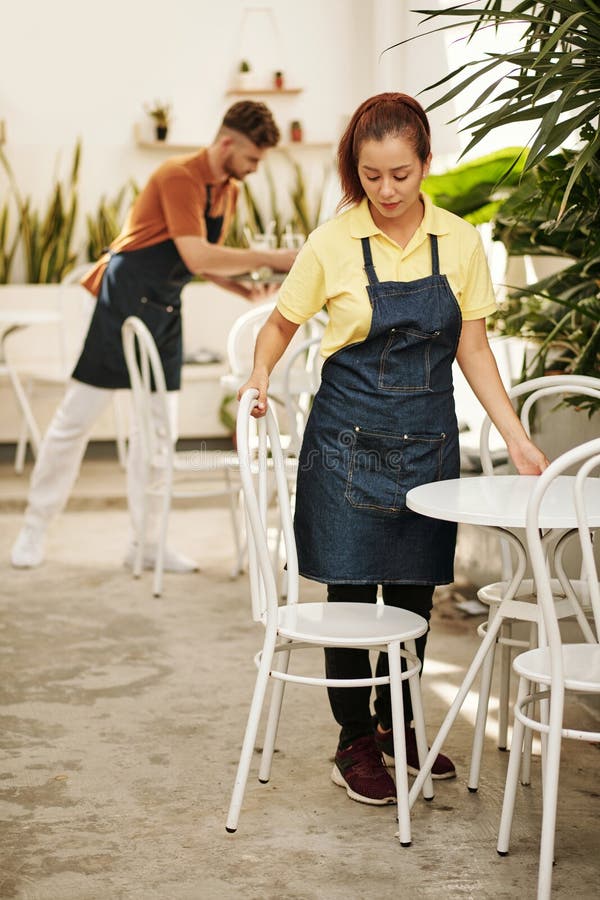 Preparing Cafe for Opening stock image. Image of young - 255308475