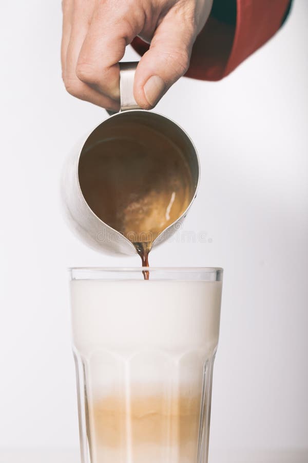 Extracting Coffee and Making Several Hot Drinks in Studio Stock Photo ...