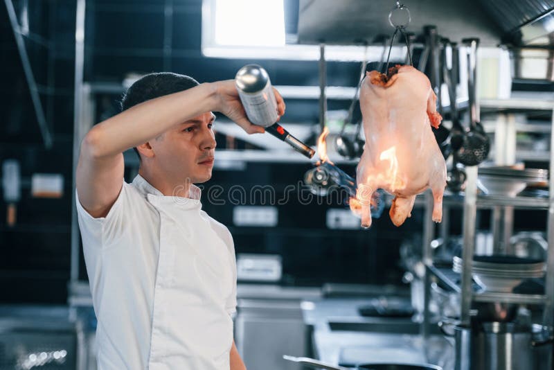 Preparing Chicken. Chef is on the Kitchen Making Food Stock Photo ...