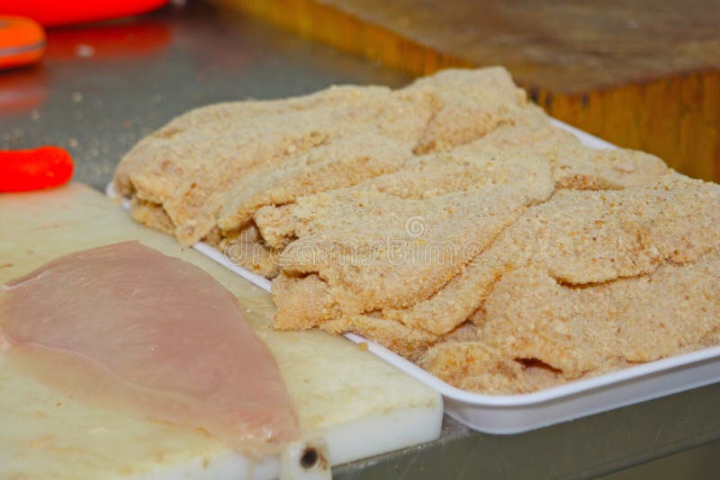 Preparing chicken cutlet stock photo. Image of milanese - 171429500