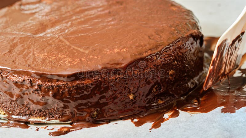 Preparing Chocolate Topping on Cake Stock Image - Image of topping ...