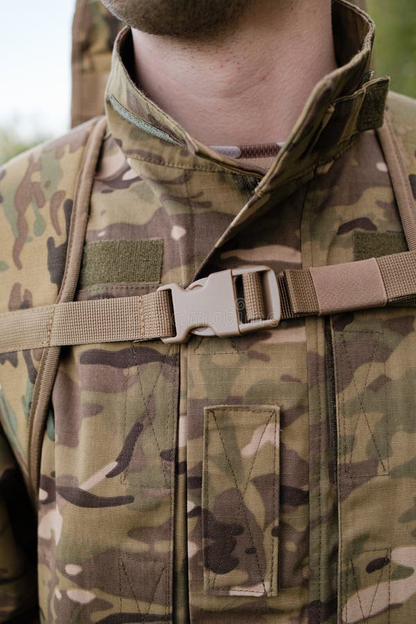 Preparing for Combat: Close-up of Soldier Putting on Gear in the Field ...