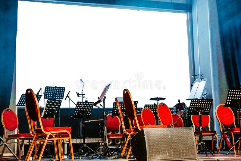 Preparing for Concert. Empty Stage and White Screen. Microphones and ...