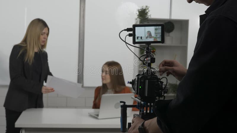 Preparing the Crew for the Video Shoot in the Studio. a Cameraman Sets ...