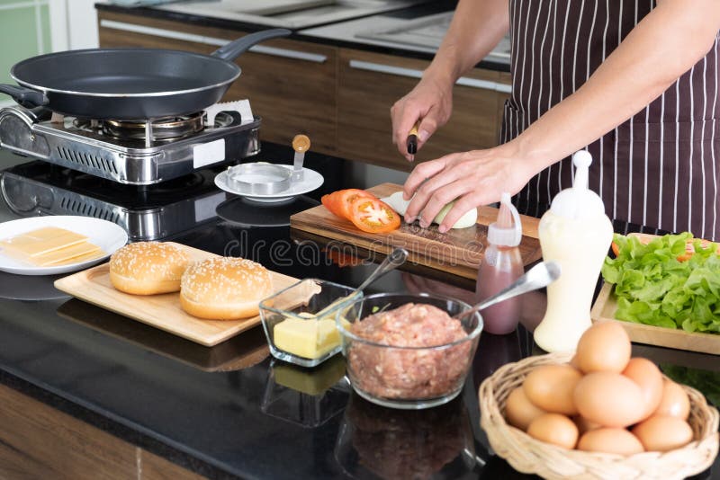 Preparing Delicious Burger in Kitchen at Home Stock Image - Image of ...