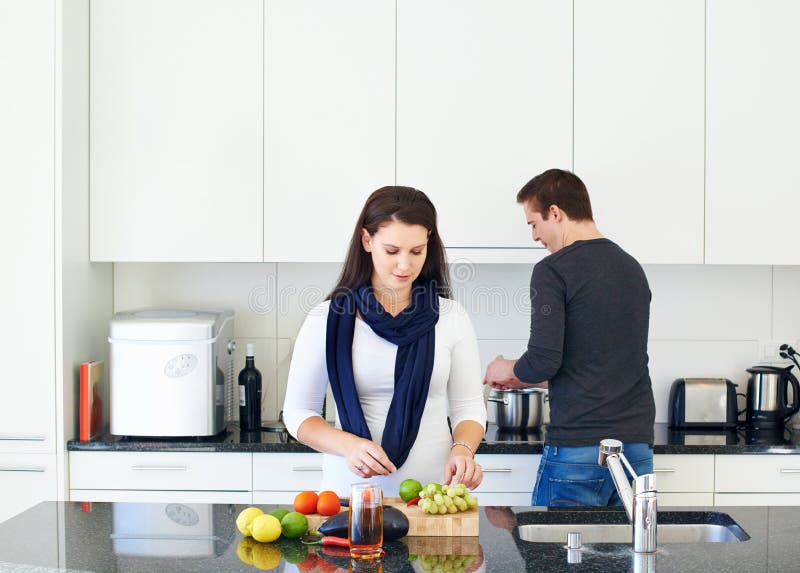 Preparing a Delicious Meal at Home. a Couple Cooking in the Kitchen ...