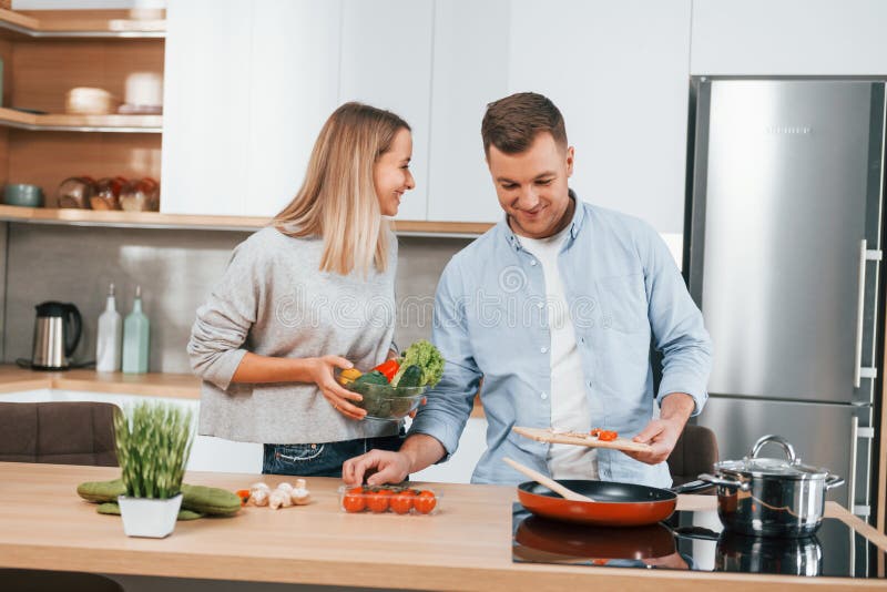 Preparing Dinner. Couple at Home on the Modern Kitchen Stock Photo ...