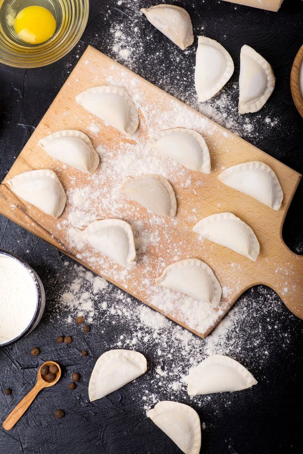 Preparing Dumplings on a Dark Table Stock Photo - Image of dish ...
