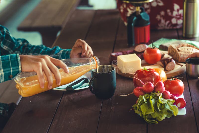 Preparing and Eating a Breakfast Outdoor Stock Photo - Image of hands ...