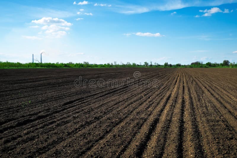 Preparing Field for Planting. Plowed Soil in Spring Time, Two Tubes and ...