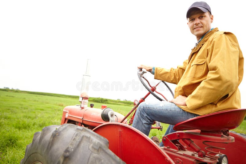 Preparing for a Hard Days Work. a Farmer Sitting on His Tractor and ...