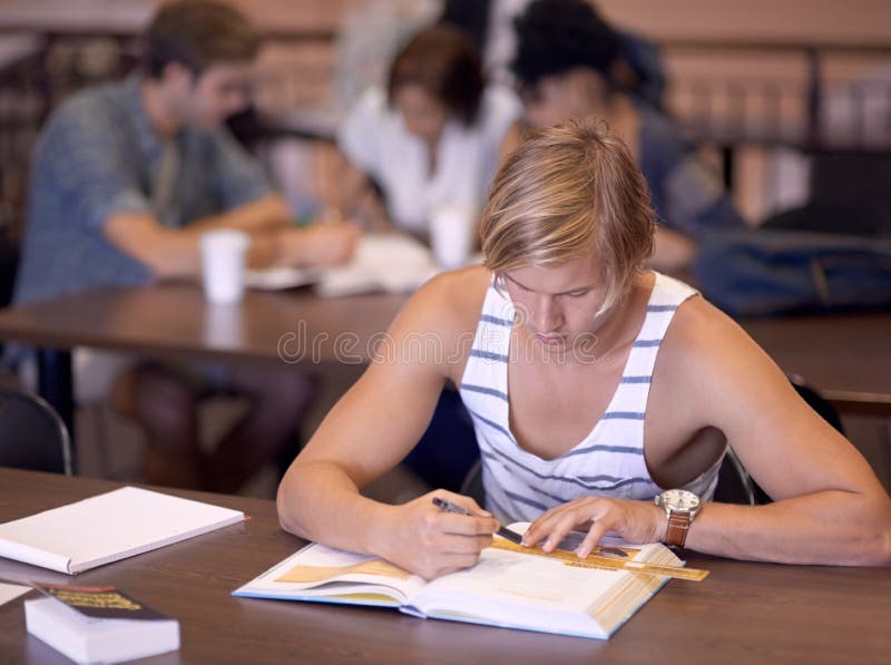 Preparing for His Future Occupation. a Young Man Studying for Exams in ...