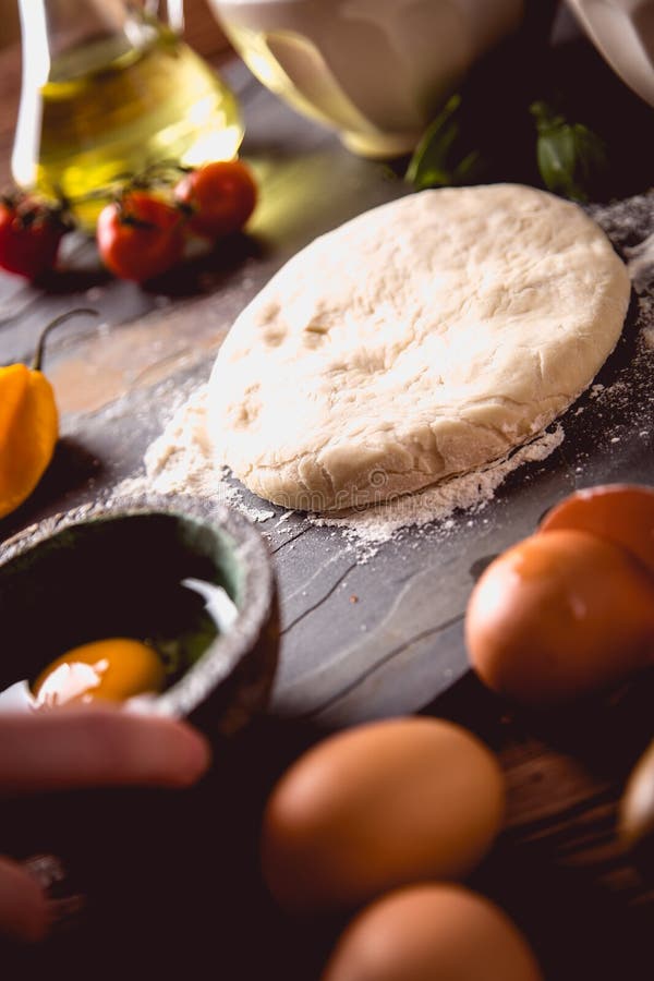 Preparing Home Pizza on Wooden Table with Ingredients Stock Image ...
