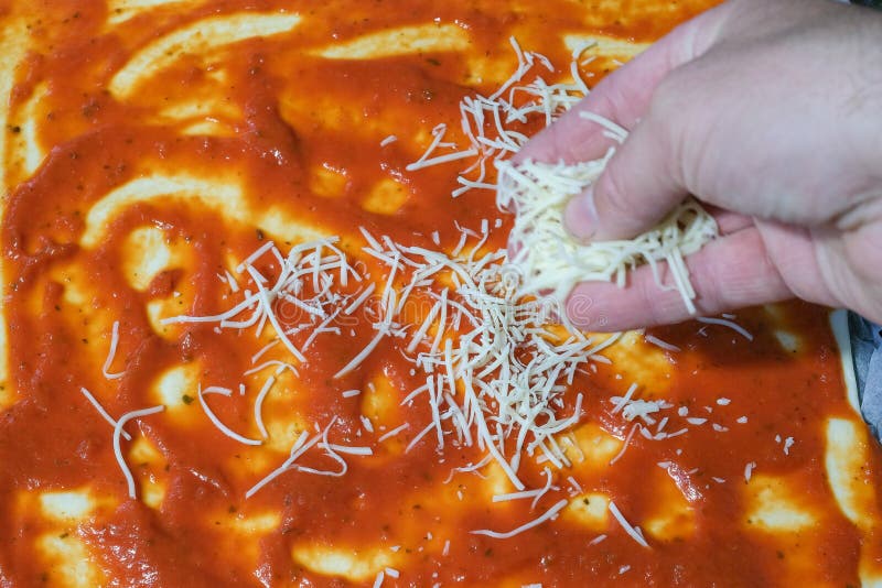 Preparing a homemade pizza stock photo. Image of homemade - 144425684