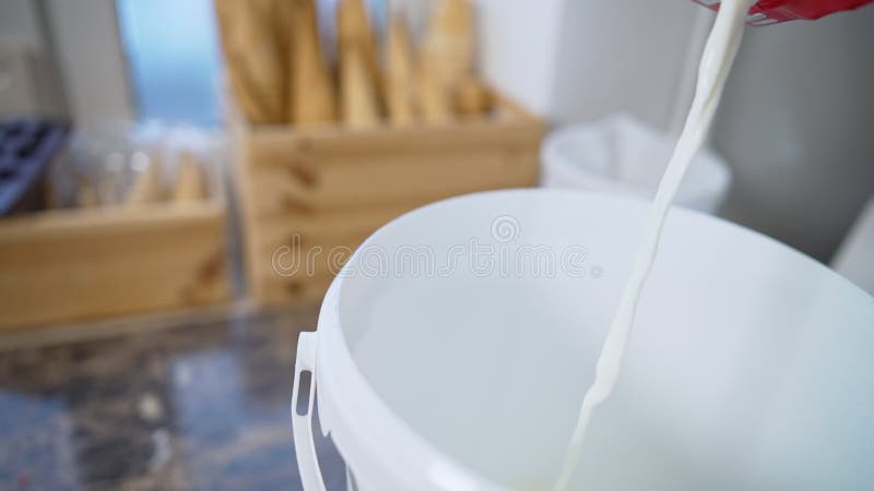 Preparing Ice Cream Formula, Adding Milk in the Liquid To Prepare Ice ...