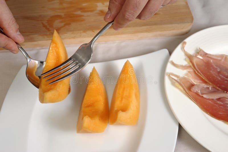 Preparing an Italian-style Melon Stock Photo - Image of slice ...