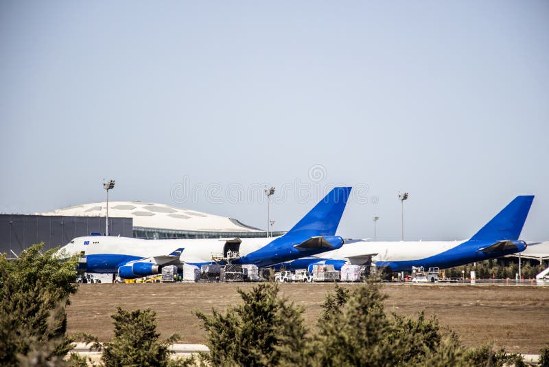 Loading Cargo on the Plane in Airport, View through Window Stock Image ...
