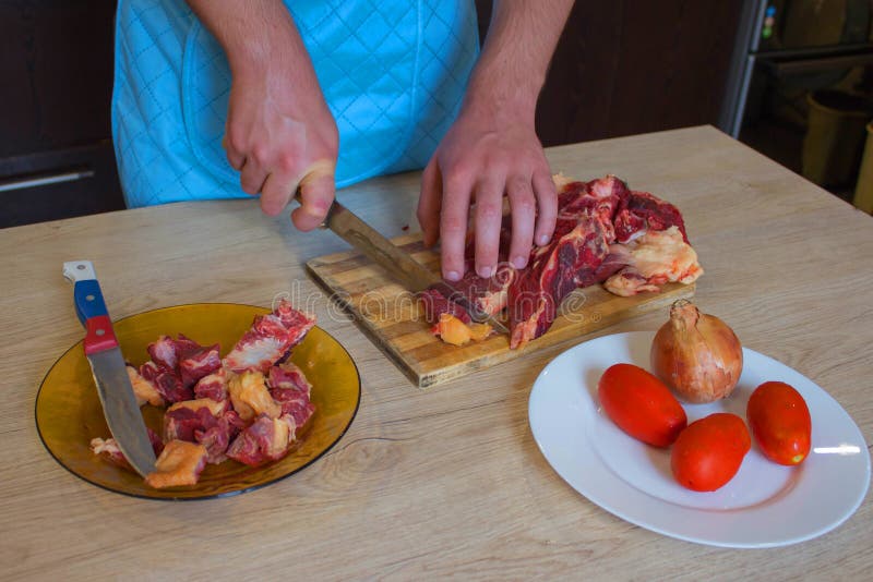 Preparing Meal, Meat. Cook Hands Cutting Raw Meat at Kitchen Table ...