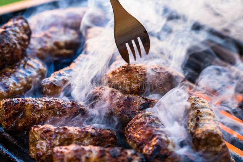 Preparing Meat Rolls Called Mici or Mititei on Barbecue. Close Up of ...