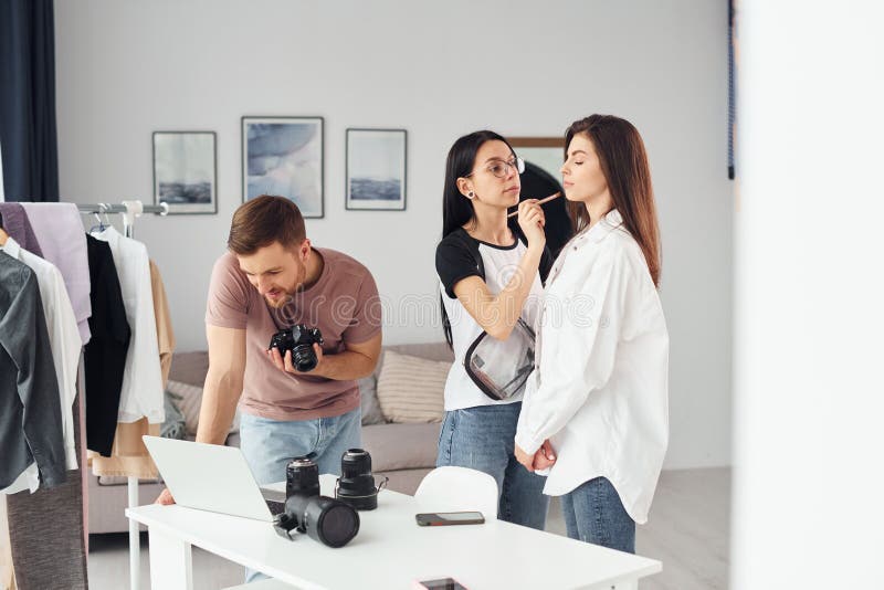 Preparing Model. Photographers Works Indoors in Their Studio at Daytime ...