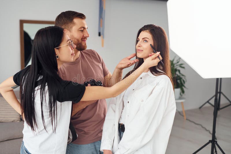 Preparing Model. Photographers Works Indoors in Their Studio at Daytime ...