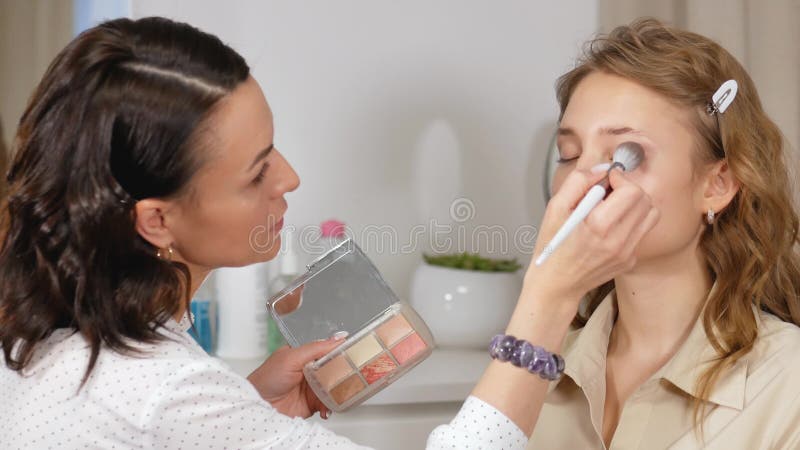 Preparing the Model`s Skin for Applying Makeup. Processing the Face ...