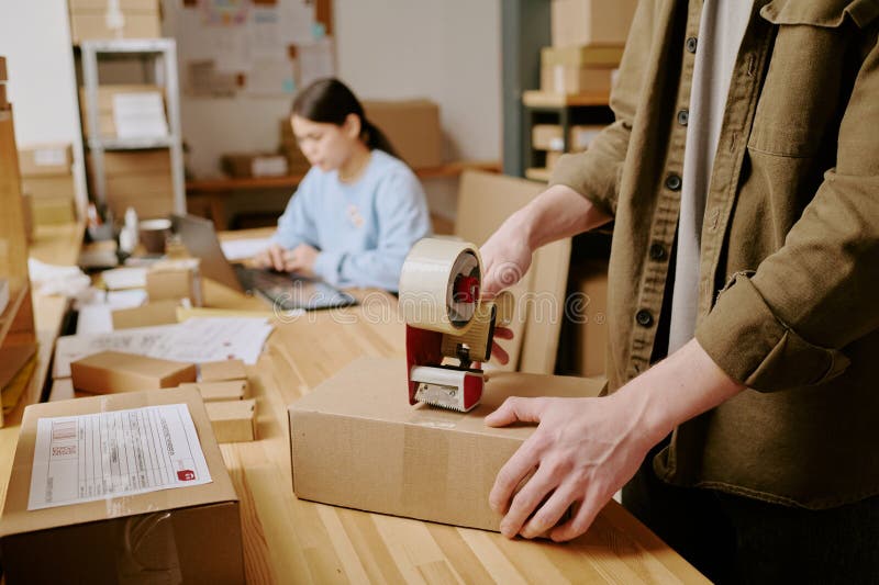 Preparing Packages in a Busy Modern Workspace Stock Photo - Image of ...