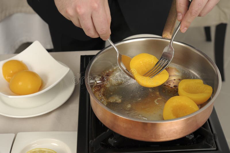 Preparing peaches flamb stock image. Image of indoors - 23708855
