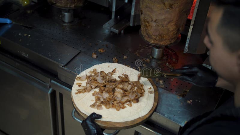 Preparing Pizza. Sliced Meat from a Vertical Grill is an Ingredient for ...