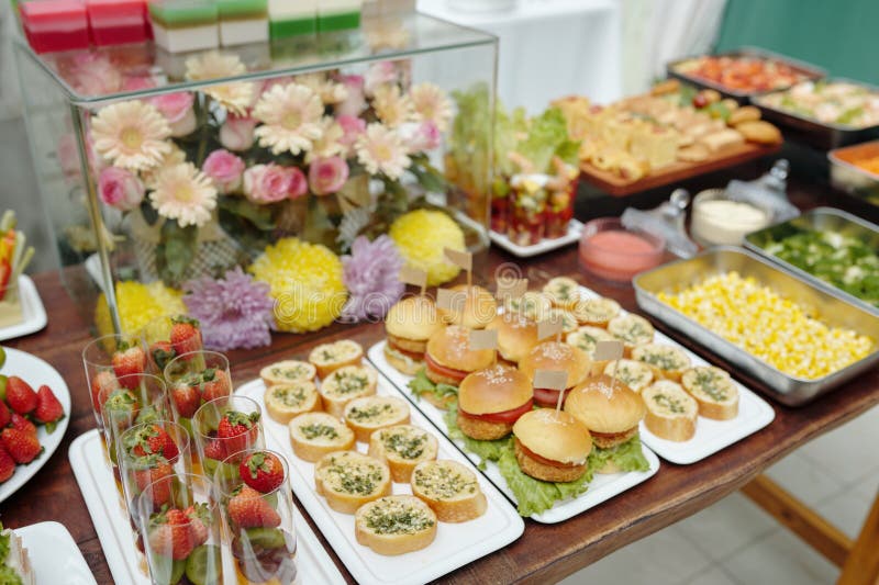 Preparing and Presenting Assorted Buffet Dishes Stock Image - Image of ...
