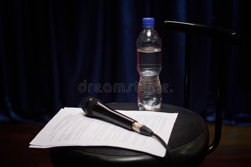 Preparing for Public Speaking Event with Microphone and Notes Stock ...