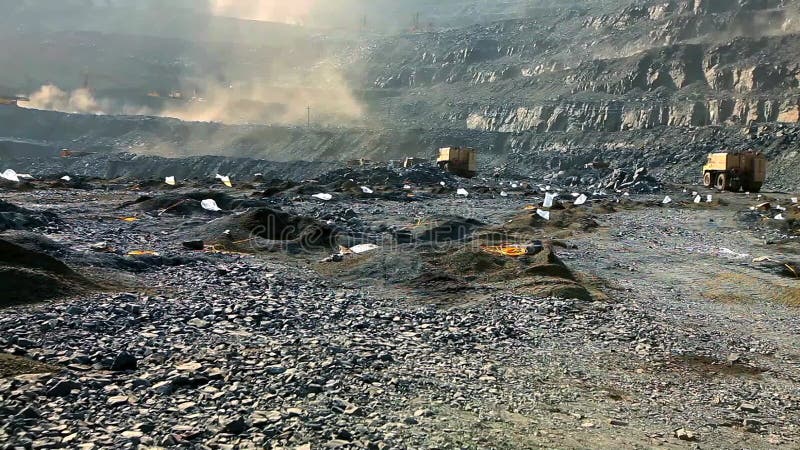 Placing a Charge in the Soil for Blasting Operations. Explosives in the ...