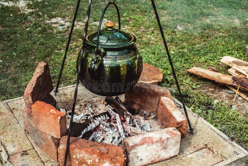 Preparing Romanian Traditional Food in Clay Dishes an Open Fire Stock ...