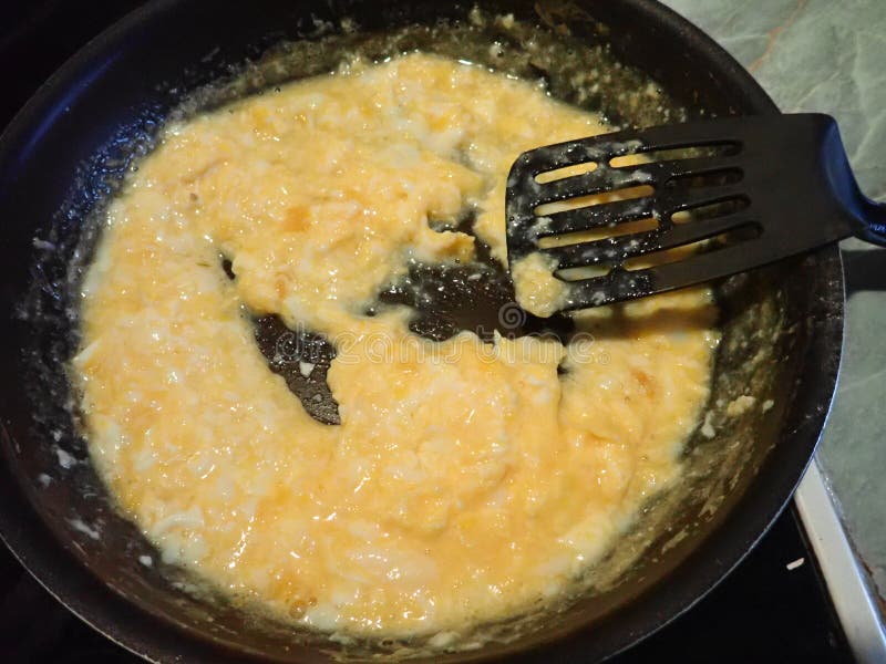 Preparing Scrambled Eggs on a Frying Pan Stock Image - Image of ...