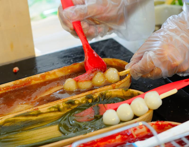 Preparing Skewered Rice Cake Balls with Toppings Stock Photo - Image of ...