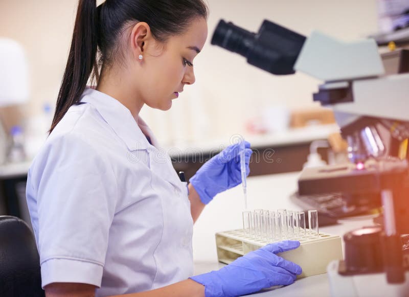 Preparing Specimens and Samples. a Young Scientist Transferring Liquid ...