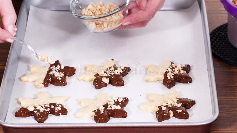 Making Star-shaped Cookies with Chocolate and Peppermint Chips Stock ...