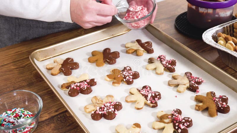 Making Star-shaped Cookies with Chocolate and Peppermint Chips Stock ...